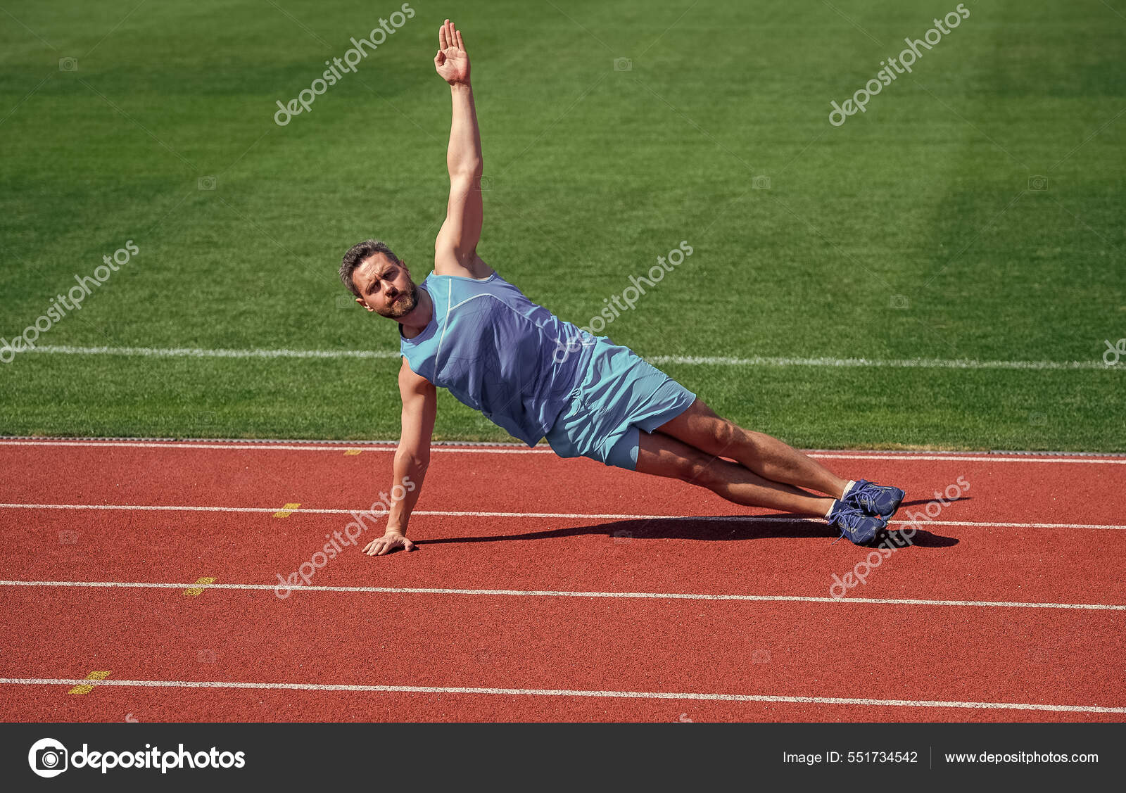 Athlete train his core muscles. man doing stretching exercise on ...