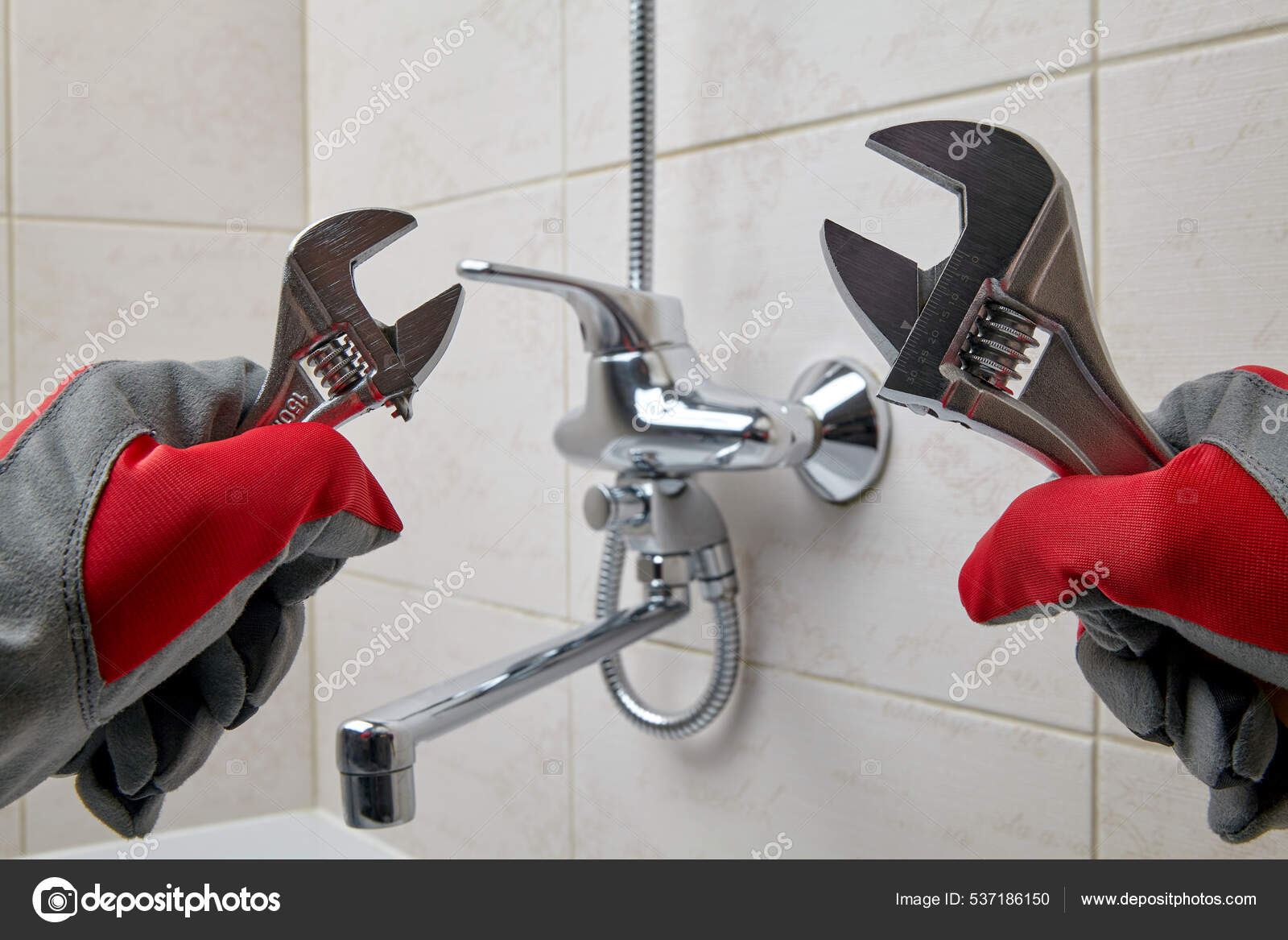 Preparing for the repair of a worn out shower valve switch Stock Photo ...