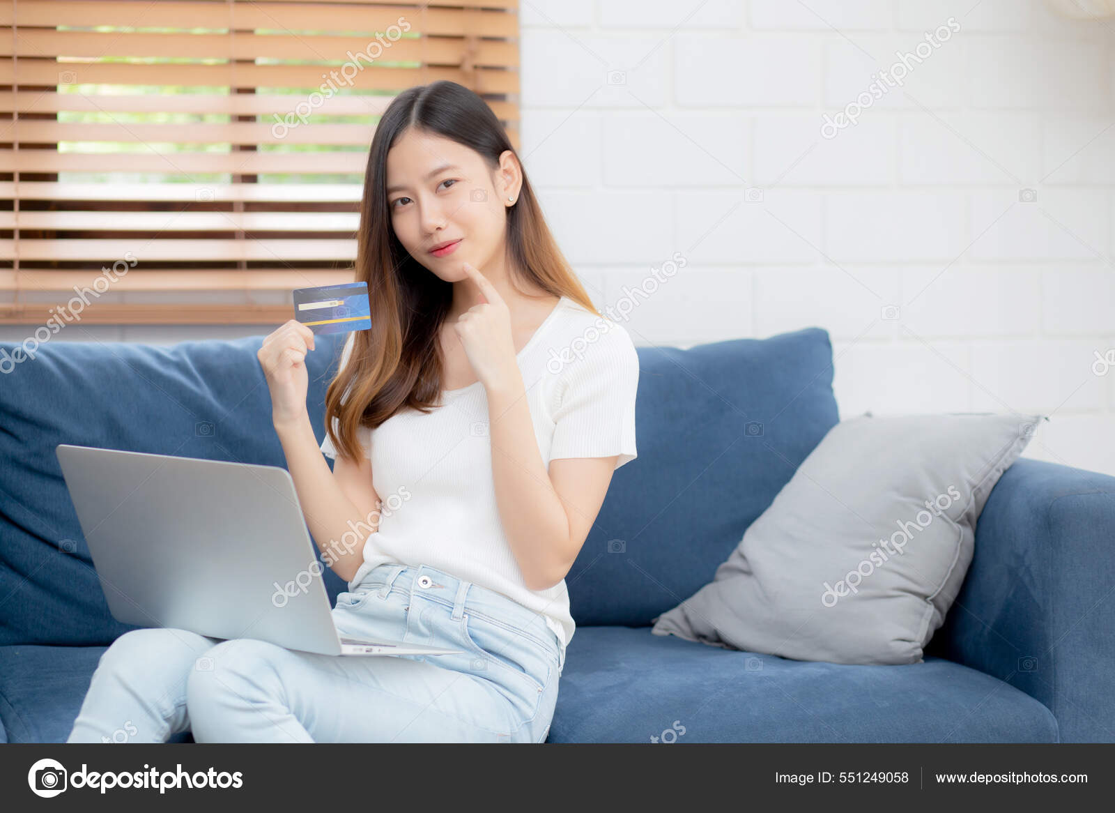 Young Asian Woman Sitting Thinking Idea Using Credit Card Laptop — Stock Photo © nnudoo #551249058