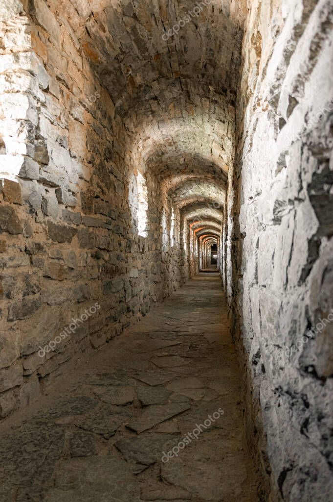 Stone Tunnels. Narrow balcony corridor with brick walls in the castle 2025