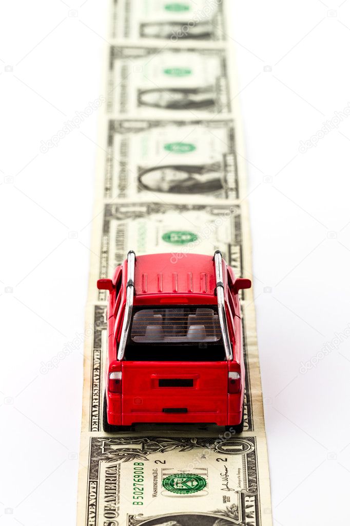 Red toy car on money road. Stock Photo by ©amnachphoto 37092179