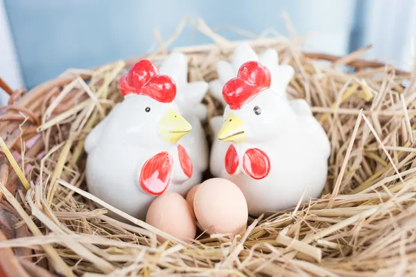 Chicken family ceramic on straw nest in straw nest - Stock Image ...