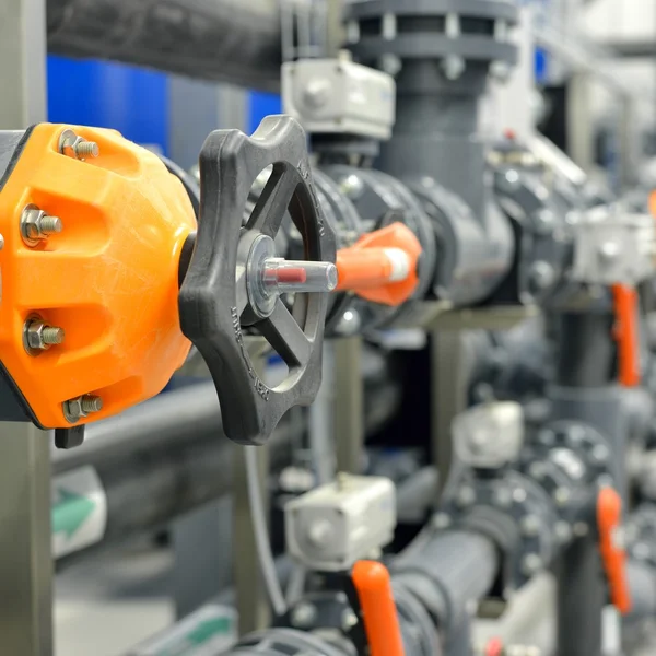 New plastic pipes and colorful equipment in industrial boiler room ...