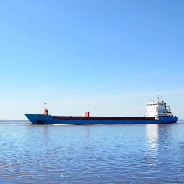Cargo container ship and small cargo ship sailing in still water ...
