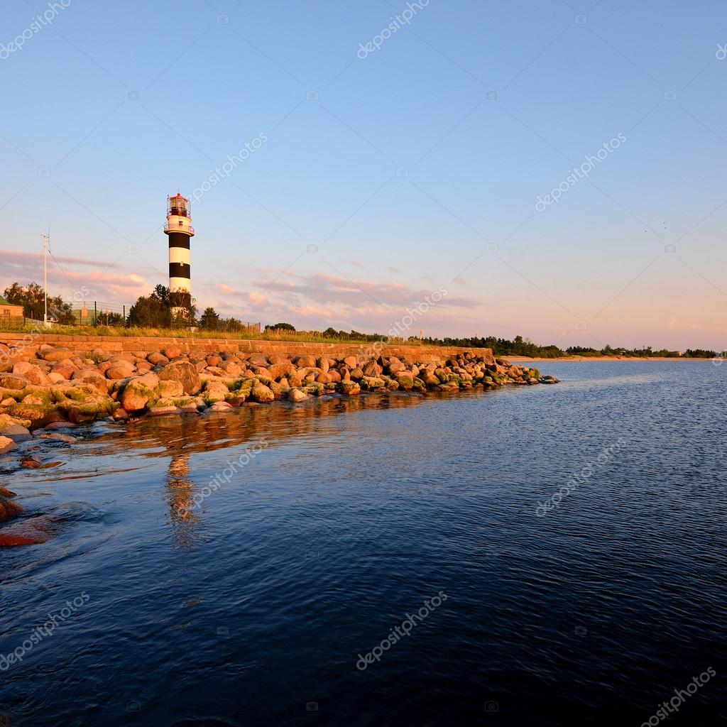 Baltic sea shore with lighthouse at the sunset. Riga, Latvia — Stock ...