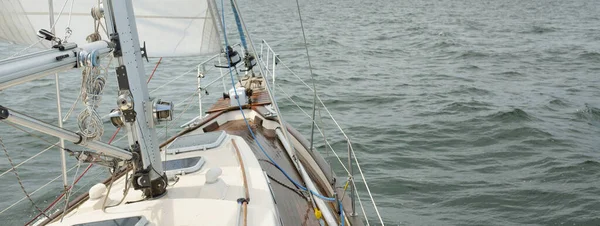 Old classic yacht sailing in an open sea during the storm. Wooden teak ...