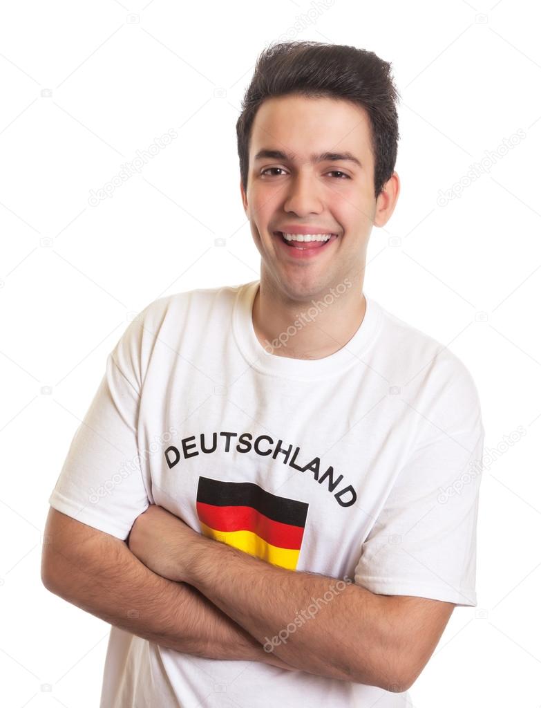 German sports fan with black hair laughing at camera — Stock Photo ...