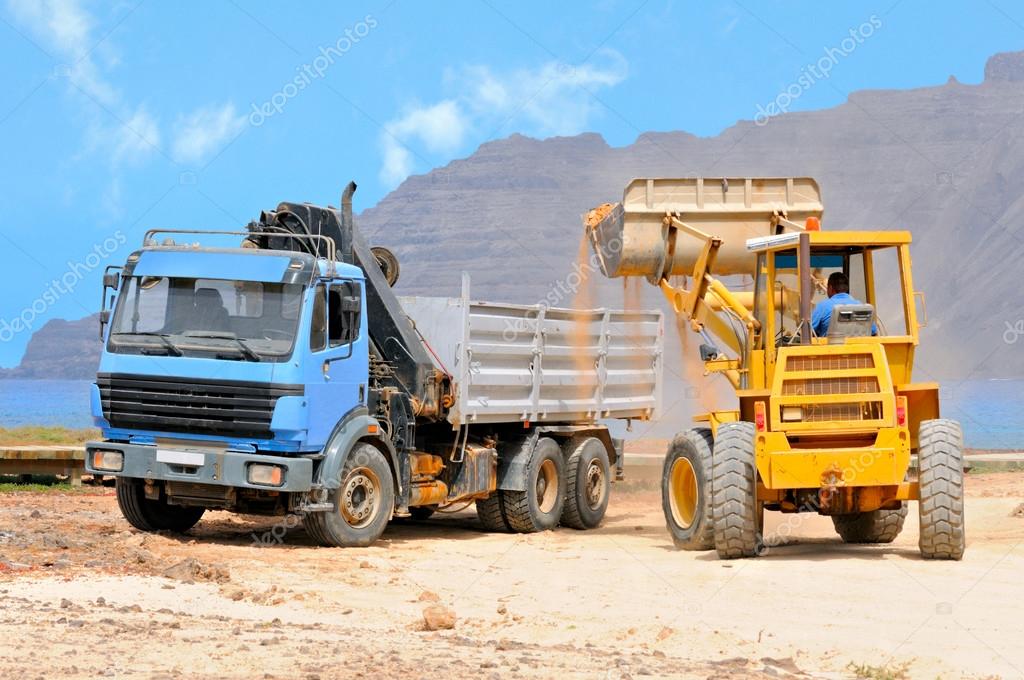 Front end loader loading dump truck — Stock Photo © anchan_uk #33811875