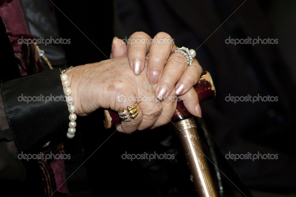 Elegant woman's hand on cane — Stock Photo © vverve #49657071