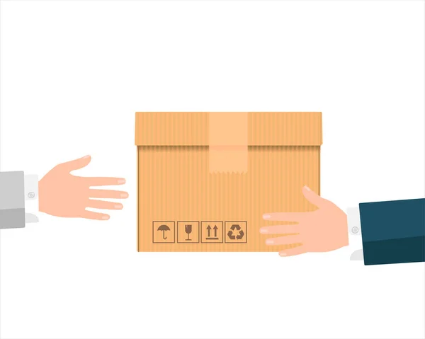 Delivery man`s hands giving cardboard package to client. Handing over ...
