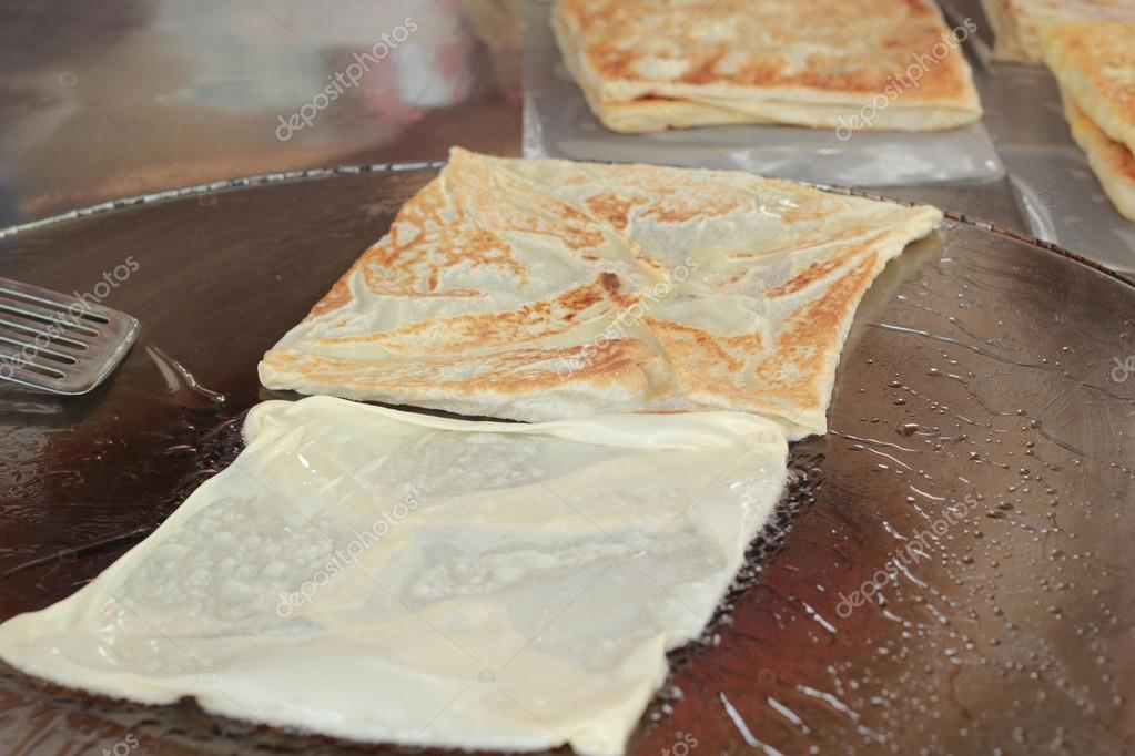 Cooking chapati on the pan — Stock Photo © seagamess #41266583