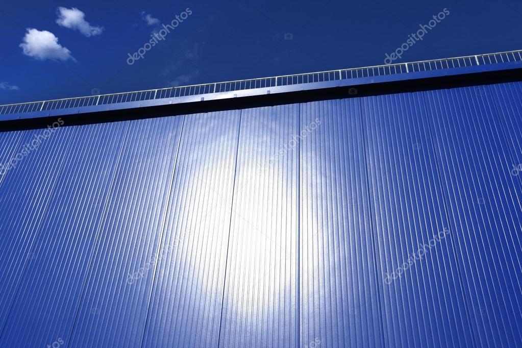 Blue wall of a building with fence Stock Photo by ©blurAZ1 34711361