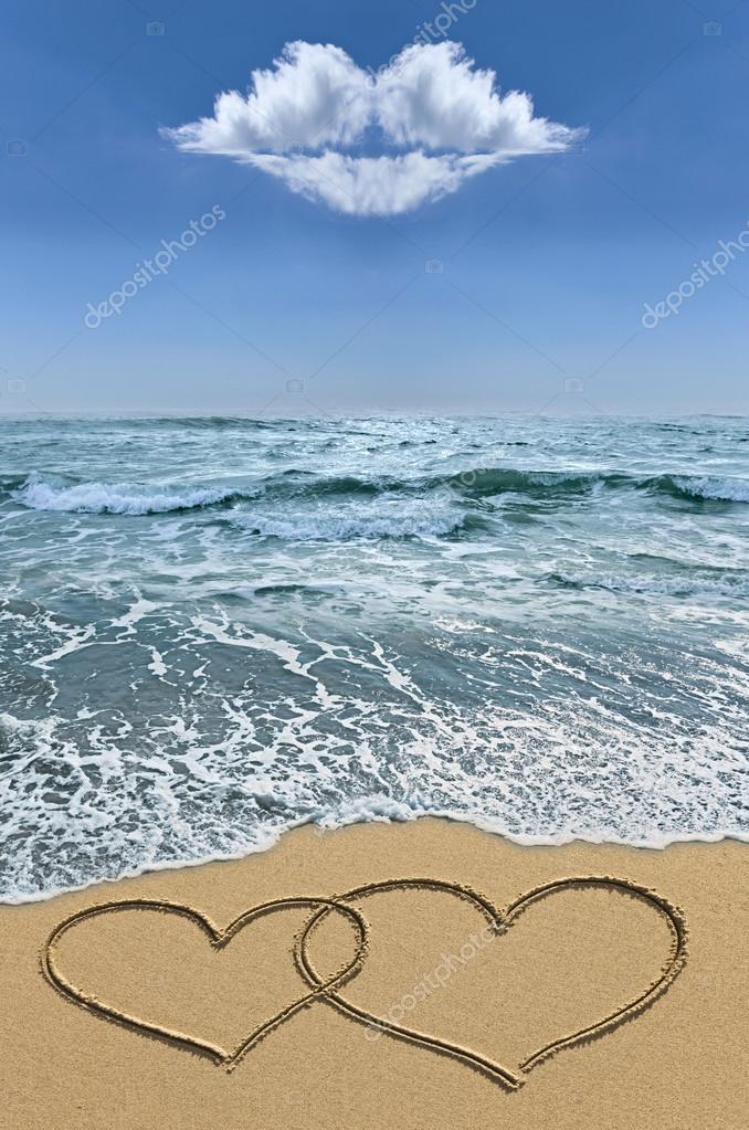 Images of hearts on the sand and lips on the sky — Stock Photo ...