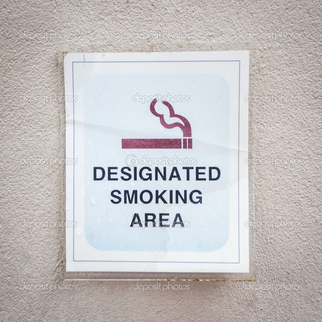 Tag for designated smoking area on wall Stock Photo by ©tortoon 33703493