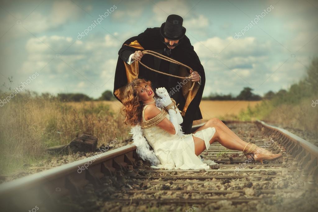 1920 style image of damsel in distress tied up by villain — Stock Photo ...