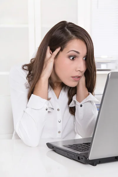 Shocked and stressed business woman at desk with her computer - - Stock ...