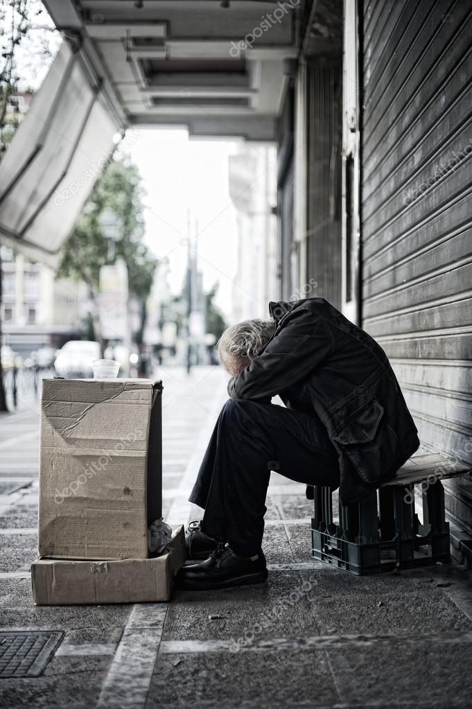 Beggar in the street – Stock Editorial Photo © fullframe #35207245