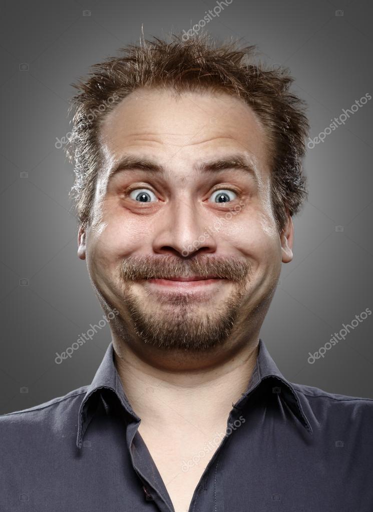 A man with a beard and mustache expression of happiness on her f ...