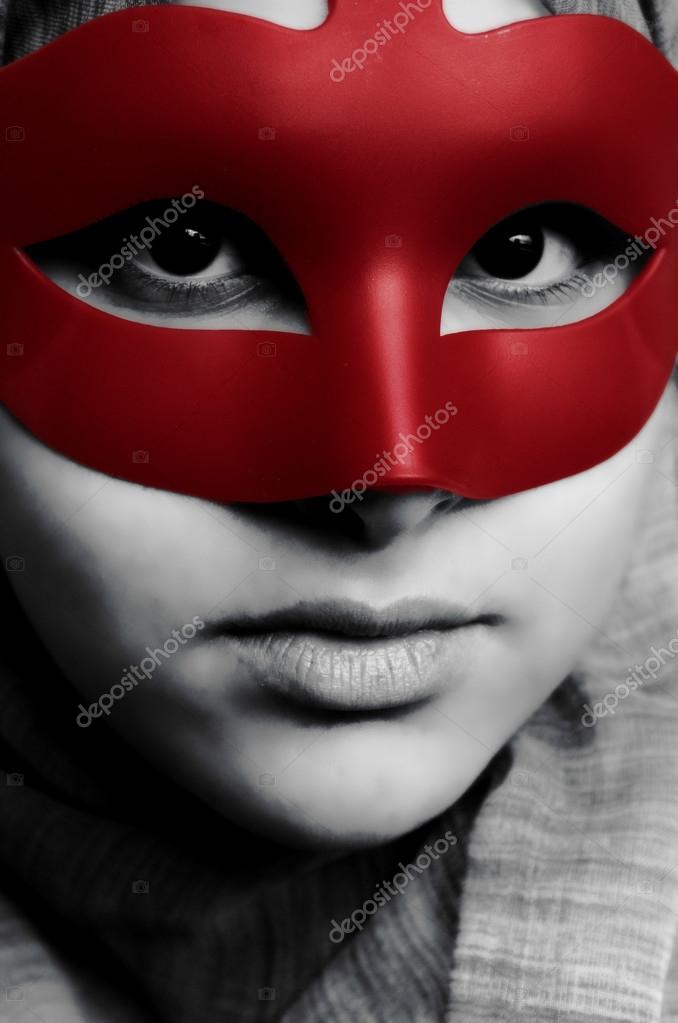 Beautiful young woman in a red mysterious mask Stock Photo by ...