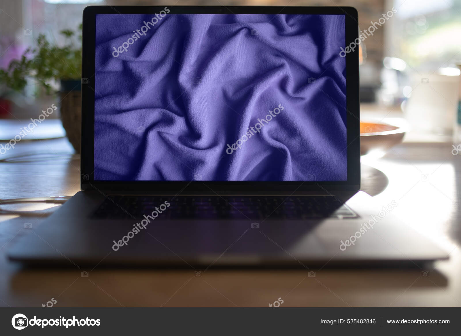 Fabric texture in the color of the year on a laptop screen. Stock Photo ...
