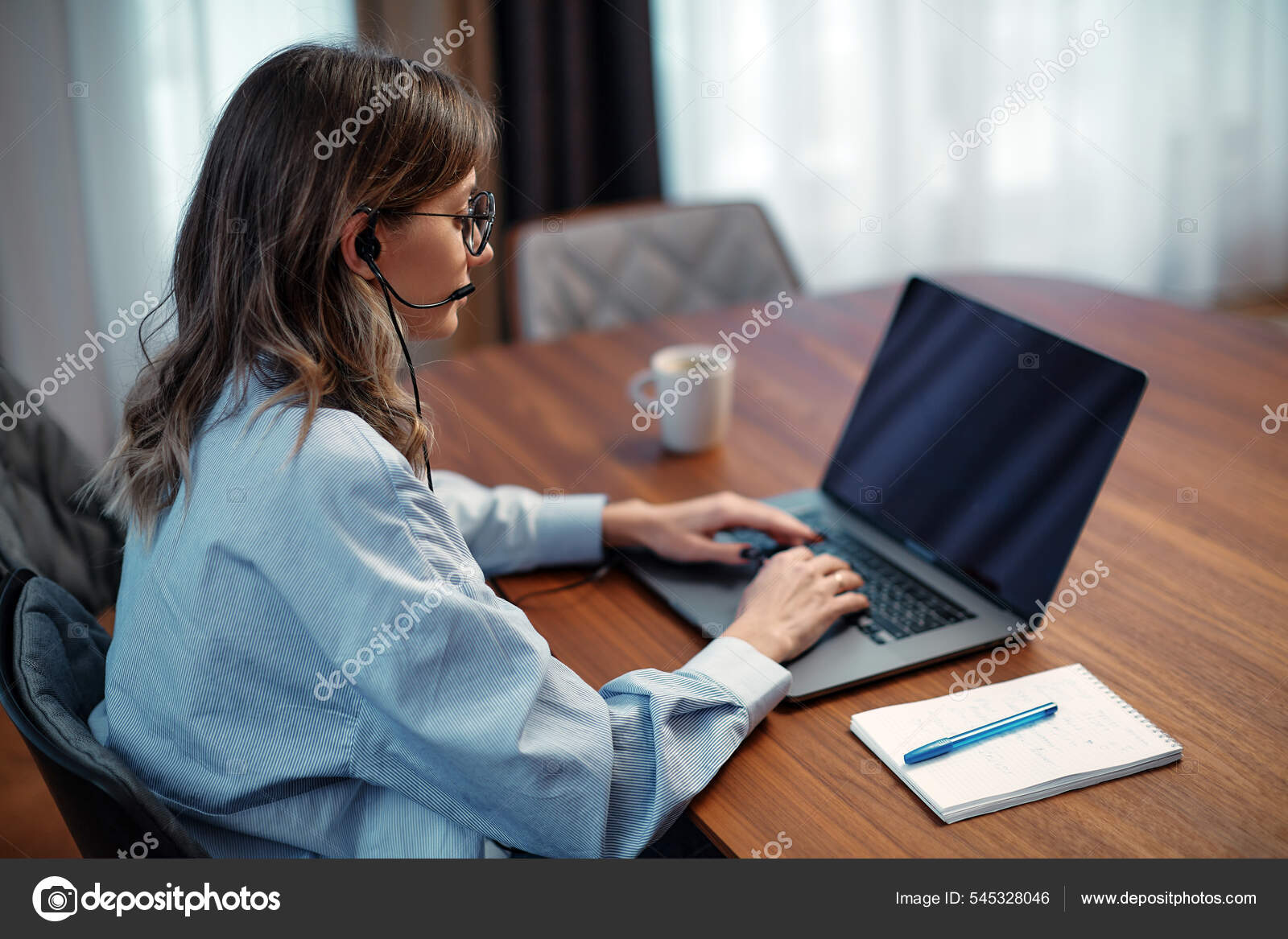 Female call center agent operator in headset ready to accept video call ...