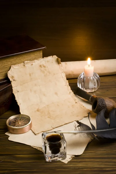 Old papers and books on a wooden table Stock Photo by ©ulkan 34653747