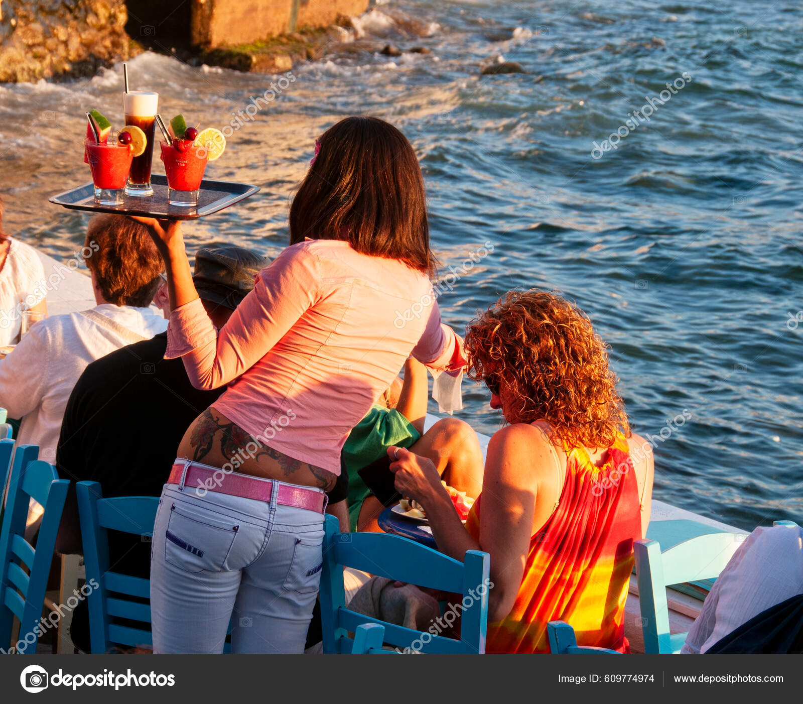 Rear View Shot Waitress Serving Exotic Drinks Tourists Seated ...