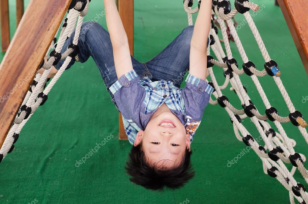 Young boy climbing rope Stock Photo by ©parinyabinsuk 48867483