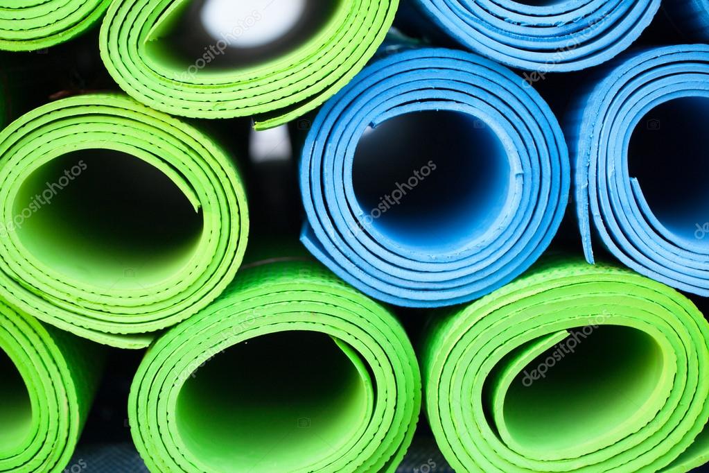 Colorful yoga mats Stock Photo by ©Tatomm 46529397