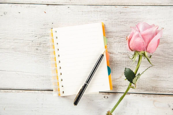 Rose and notepad — Stock Photo © Tiko0305 #158884524