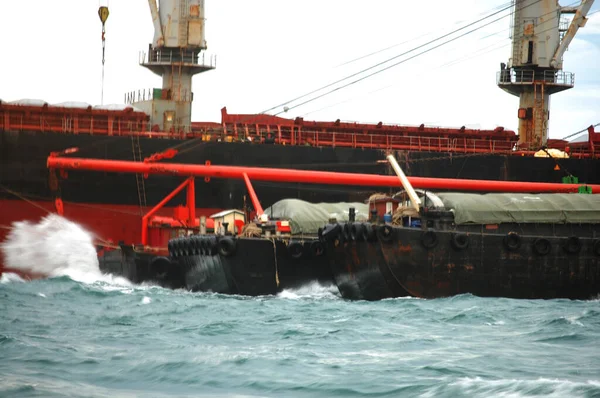Freighter cargo ship floating in sea ocean wait queue transfer goods ...