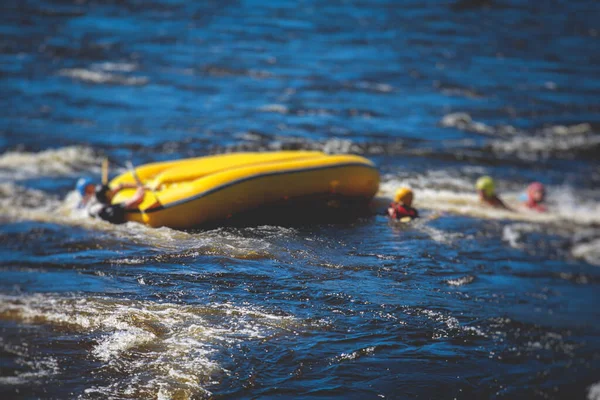 Boat is turned upside down during rafting extreme water sports with man ...