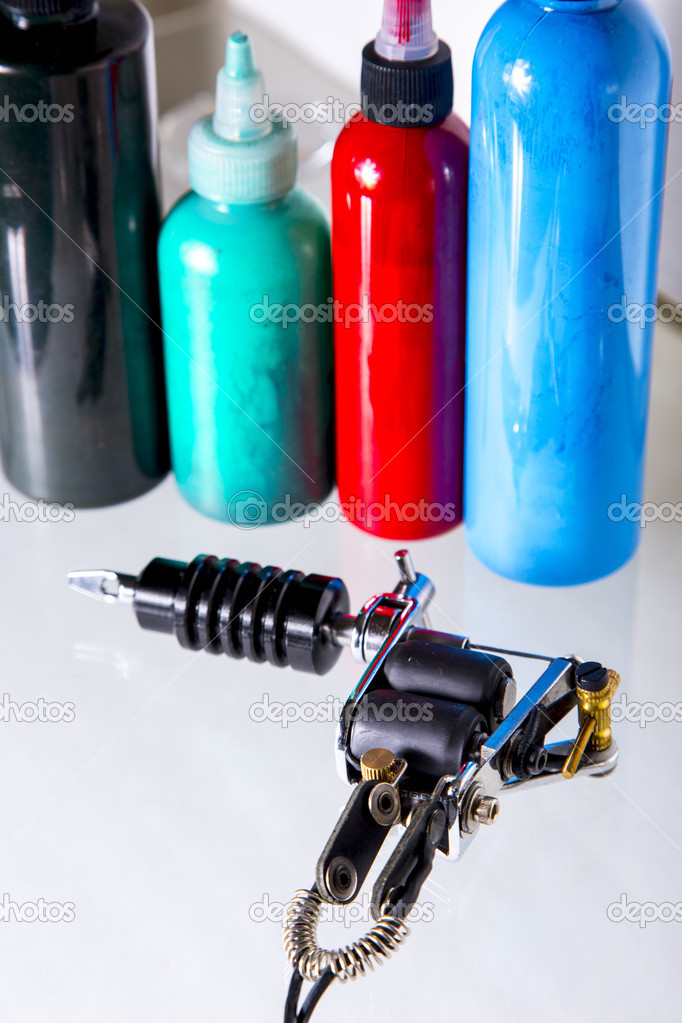 Tattoo gun and ink tubes Stock Photo by ©ZOOMYimages 36745595