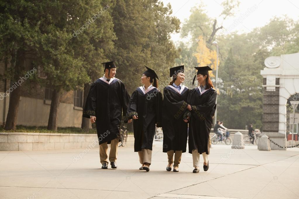 Young Graduates Walking Across Campus Stock Photo by ©XiXinXing 36087111