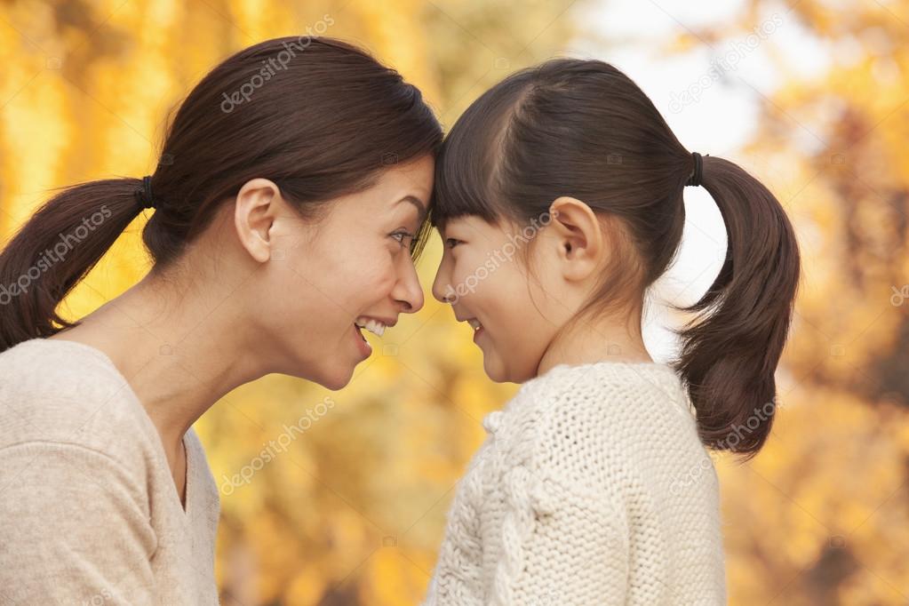 Mother and Daughter face to face Stock Photo by ©XiXinXing 36634081