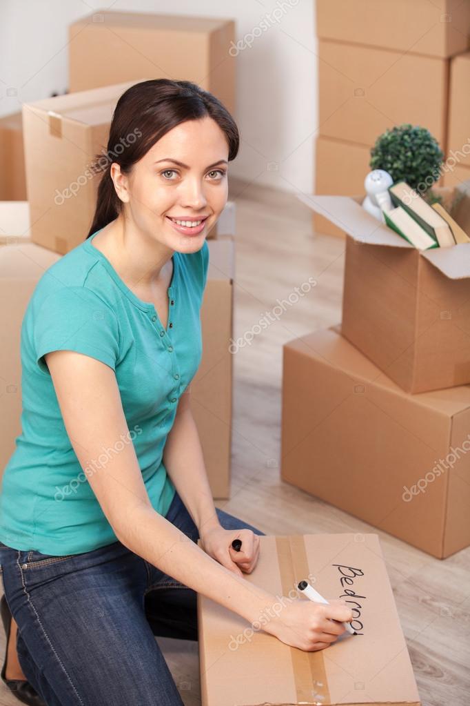 Marking a carton box. Stock Photo by ©gstockstudio 38292559