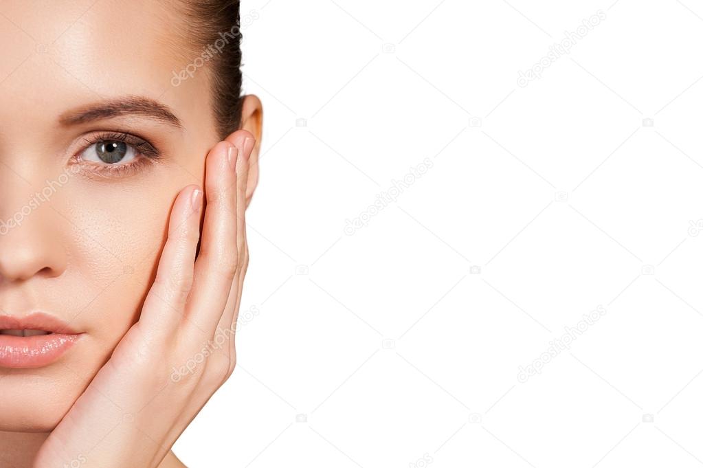 Woman holding hand on cheek and looking at camera — Stock Photo ...