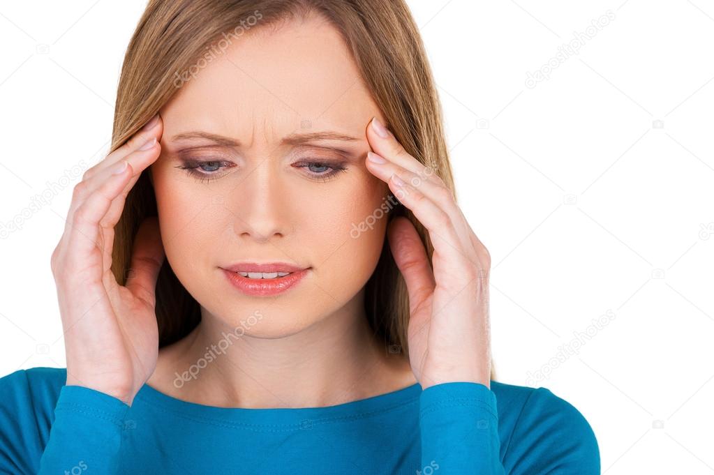 Woman touching head with hands and looking down — Stock Photo ...