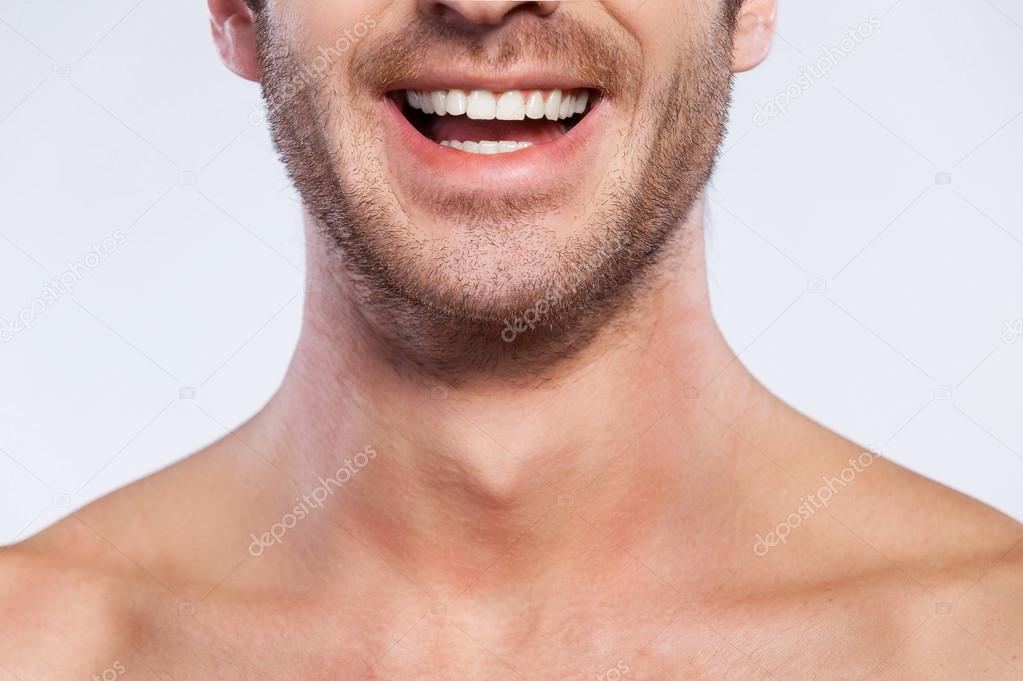 Handsome young shirtless man smiling — Stock Photo © gstockstudio #42799359