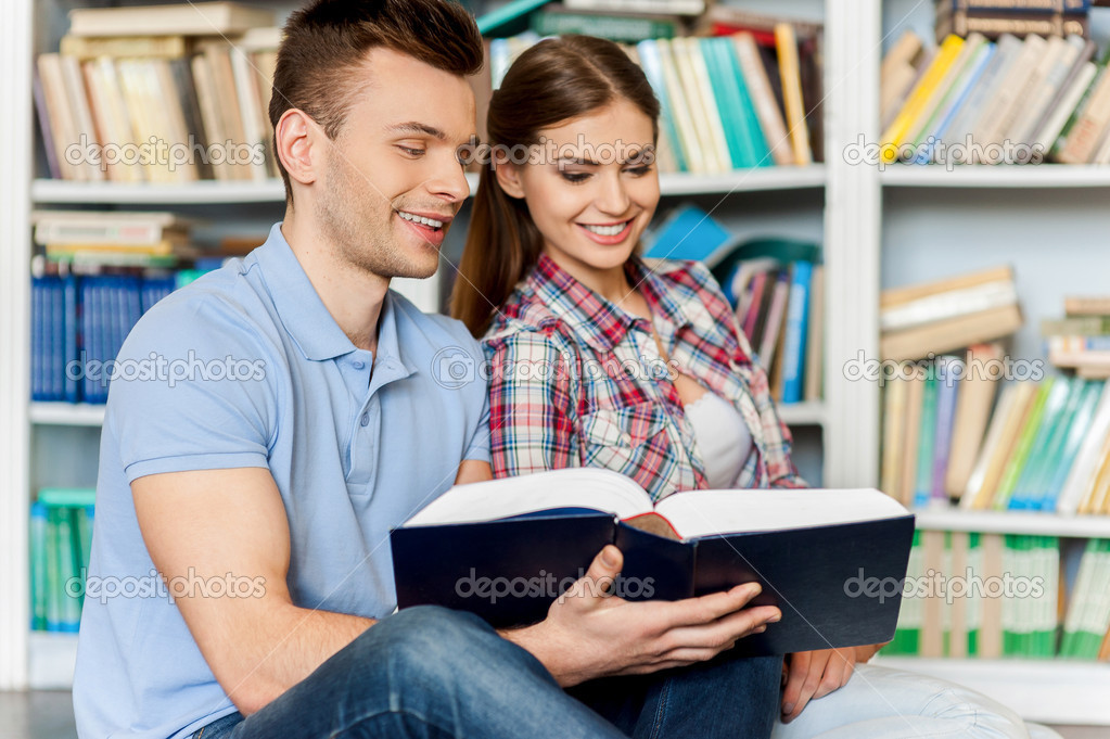 Couple reading a book together Stock Photo by ©gstockstudio 44026997
