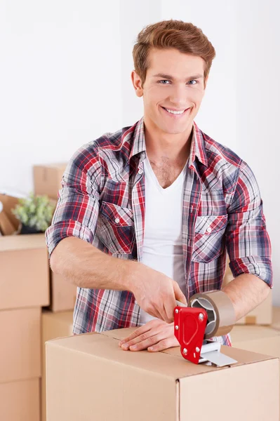 Man packing boxes Stock Photo by ©gstockstudio 46554745