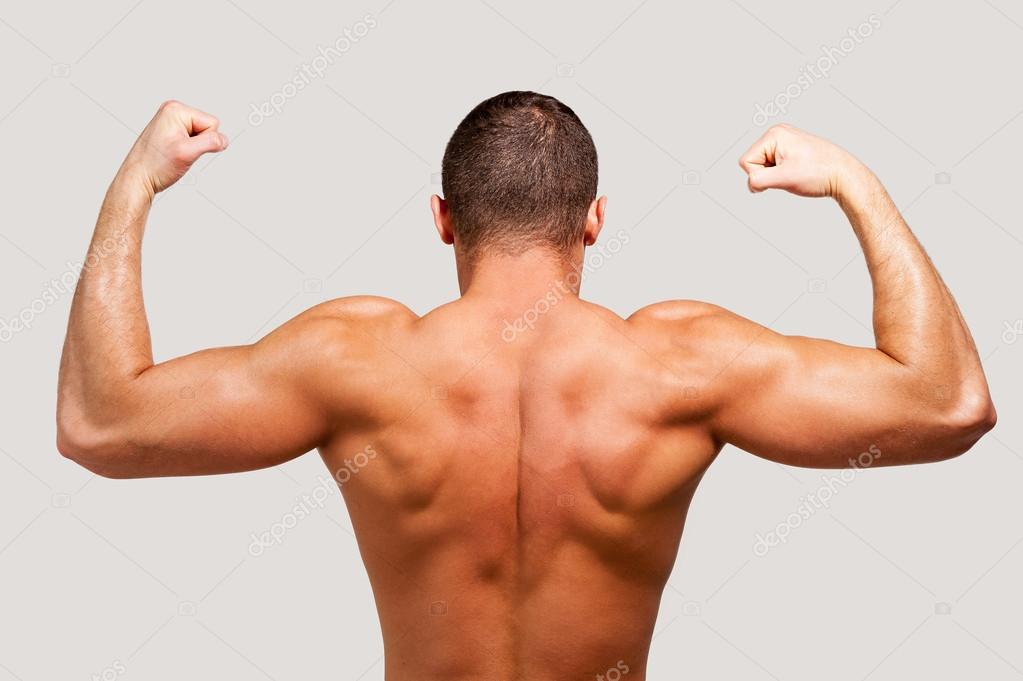 Rear view of young muscular man Stock Photo by ©gstockstudio 46678057