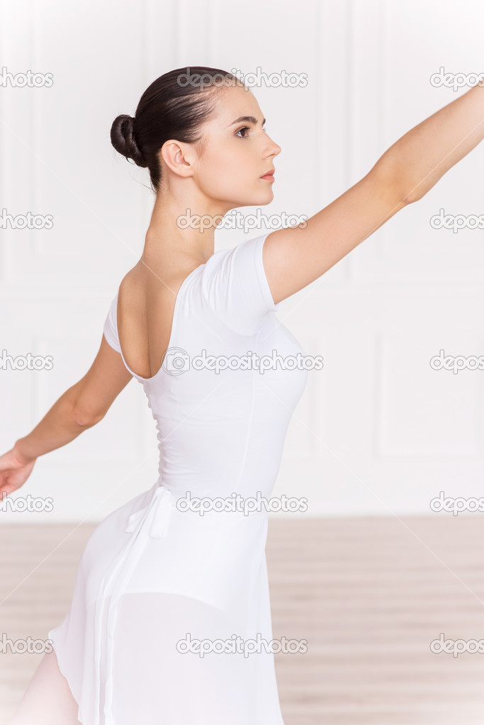 Ballerina dancing in ballet studio — Stock Photo © gstockstudio #48638311