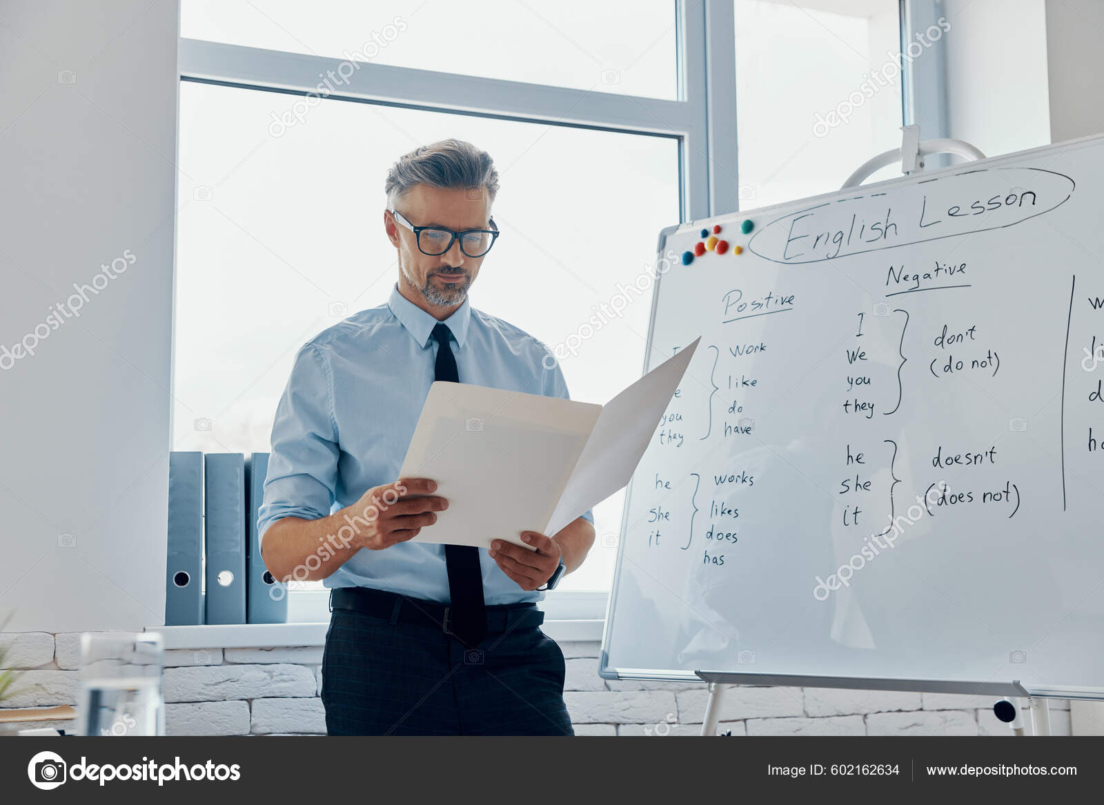 Confident English Teacher Going Papers While Standing Whiteboard ... Confident English Teacher Going Papers While Standing Whiteboard ...