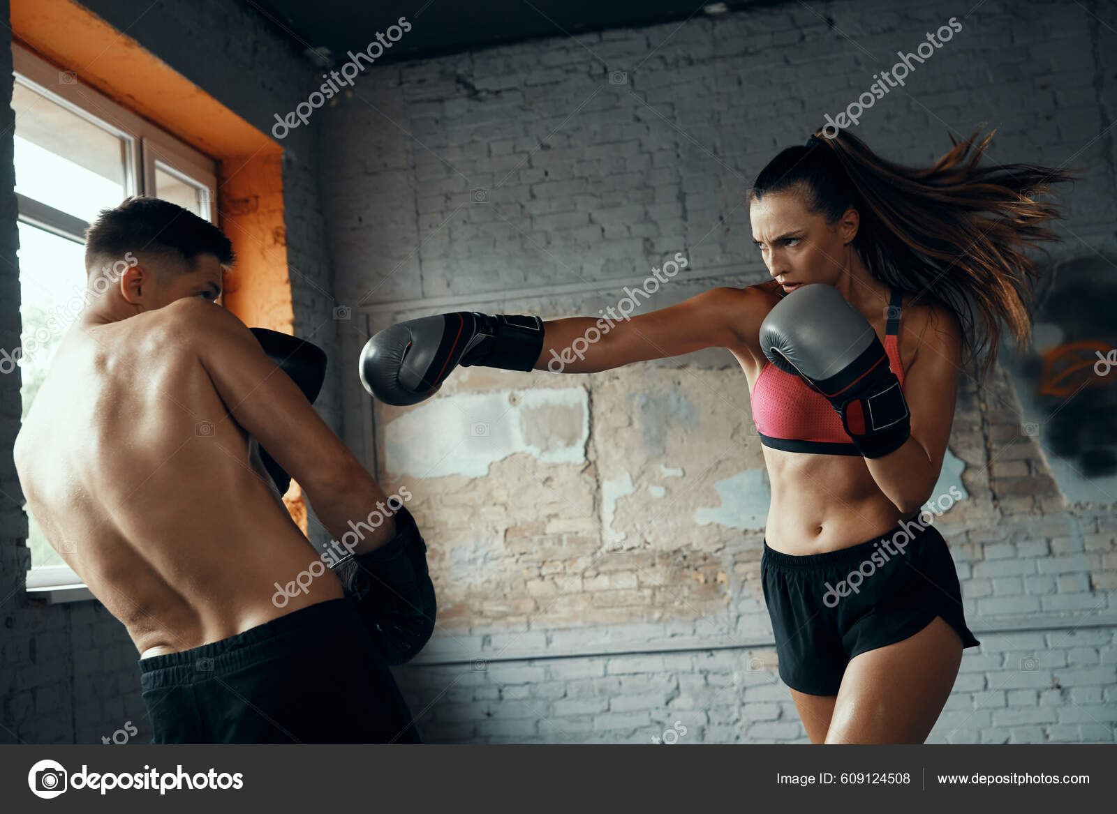 Concentrated Young Woman Boxing Her Sparring Partner Gym — Stock Photo © gstockstudio #609124508