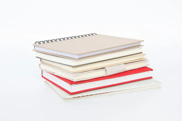 A stack of paper notebooks Stock Photos, Royalty Free A stack of paper ...