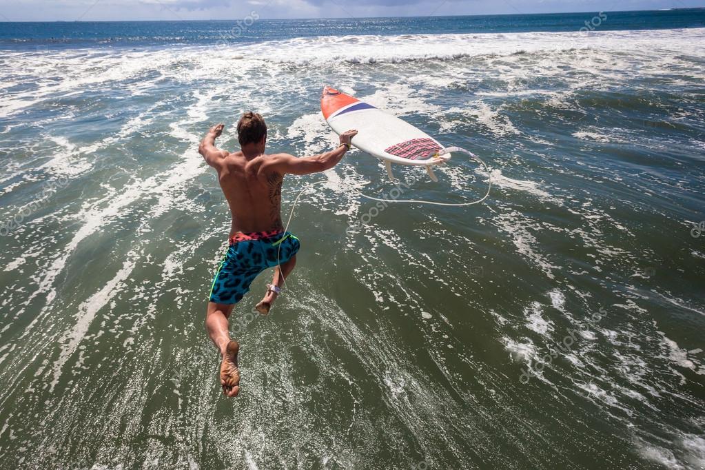 Surfer Pier Ocean Jump – Stock Editorial Photo © ChrisVanLennepPhoto ...