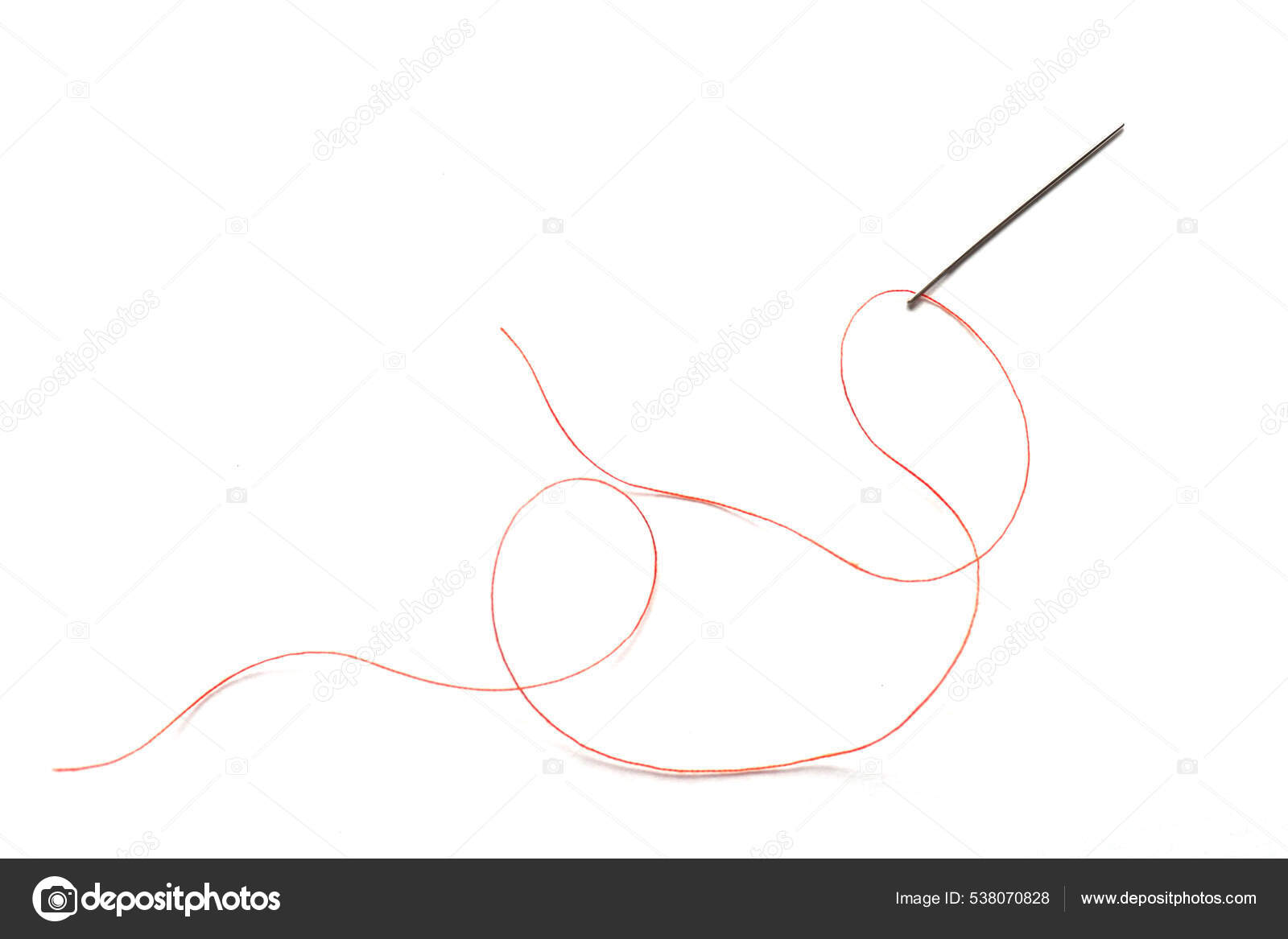 Needle with orange thread on a white background. Sewing accessories ...