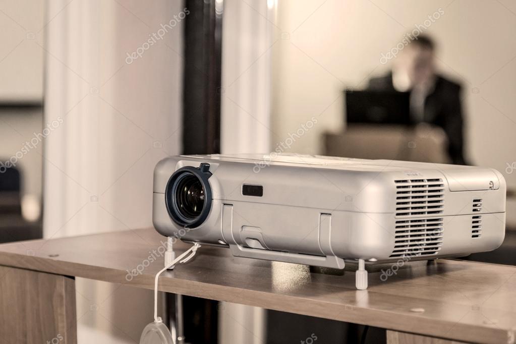 Projector on office table Stock Photo by ©mariakray 42290191