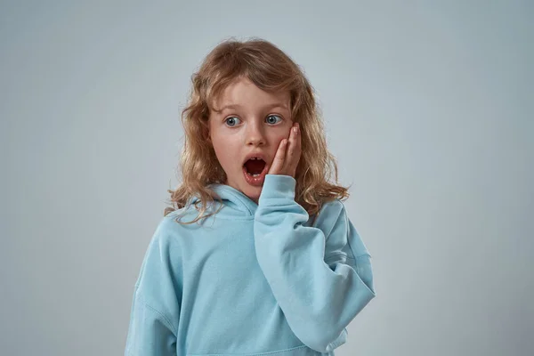 Front view of surprised little girl looking away — Stock Photo ...